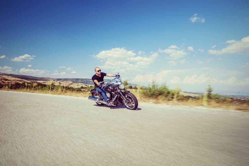 Young Biker Riding a Motorcycle on an Open Road Stock Image - Image of ...