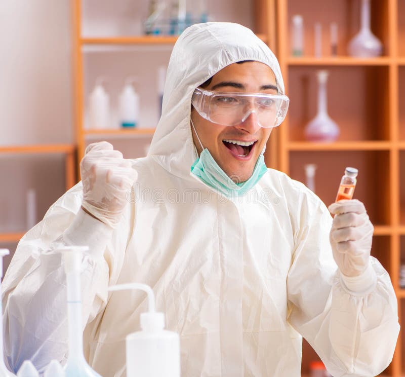 Young Biochemist Wearing Protective Suit Working in the Lab Stock Photo ...
