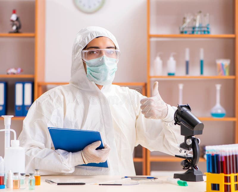 Young Biochemist Wearing Protective Suit Working in the Lab Stock Image ...