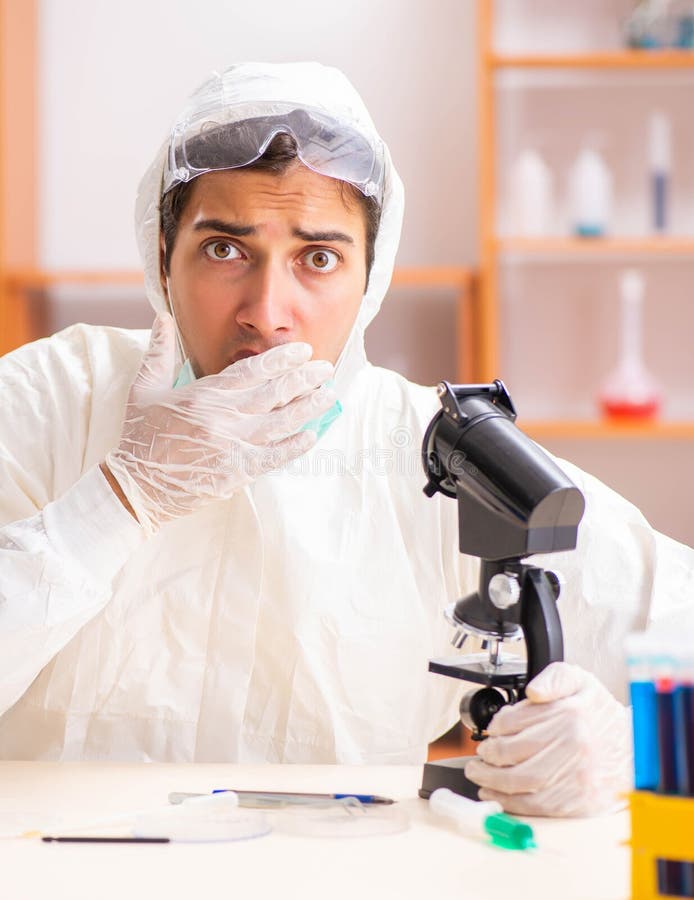 Young Biochemist Wearing Protective Suit Working in the Lab Stock Image ...