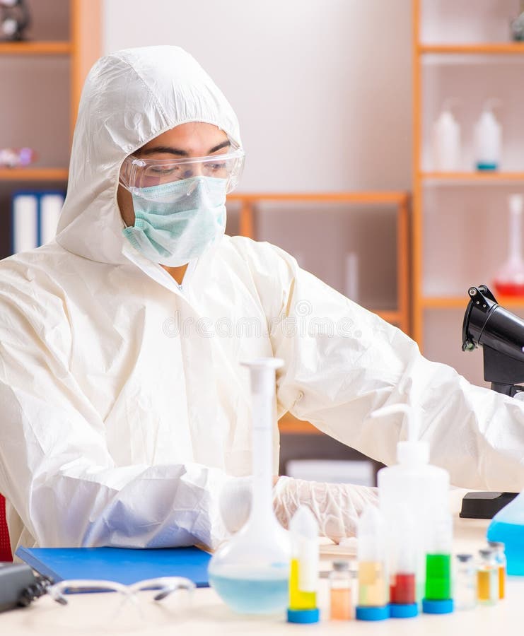 Young Biochemist Wearing Protective Suit Working in the Lab Stock Photo ...
