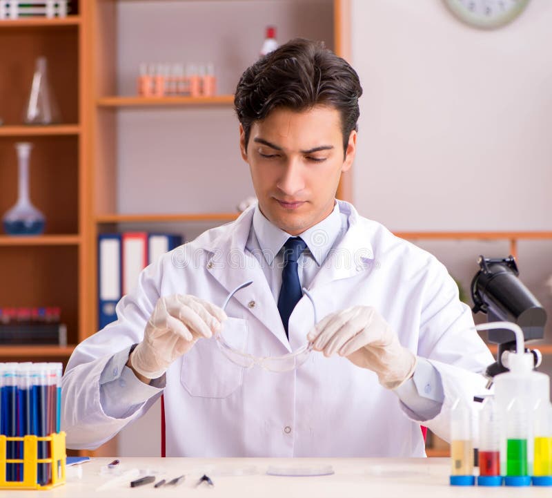 Young Biochemist Working in the Lab Stock Image - Image of examining ...