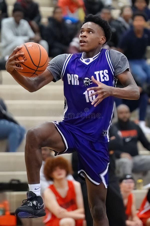 Young Black Basketball Player in a Blue Jersey Dunking the Ball ...