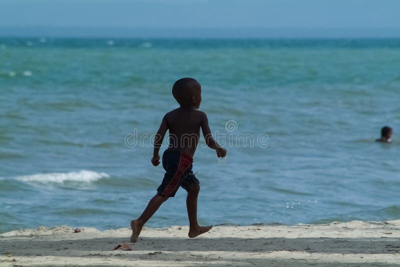 A Young Black Boy Running on Beach Editorial Stock Image - Image of ...