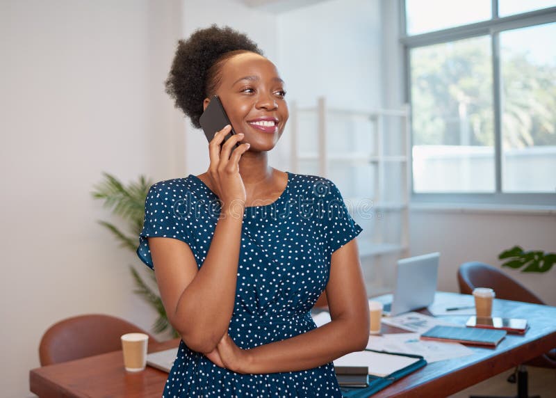 Young Black Business Woman Talks on Cellphone in Boardroom Smiling ... Young Black Business Woman Talks on Cellphone in Boardroom Smiling ...