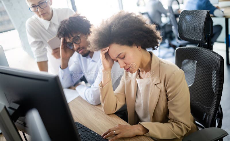 Young African Business Woman Having Stress And Headache In The Office