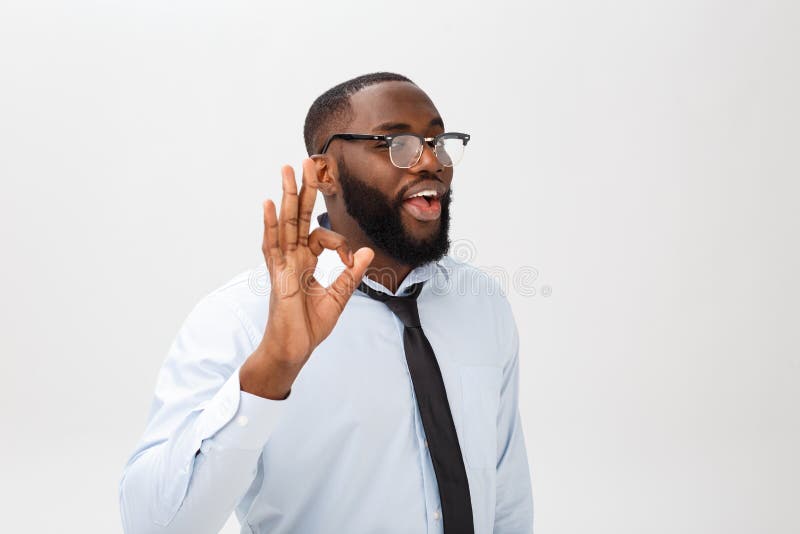 Young Black Businessman Having Happy Look, Smiling, Gesturing, Showing ... Young Black Businessman Having Happy Look, Smiling, Gesturing, Showing ...