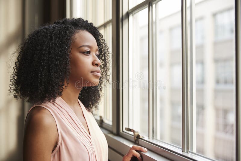 Young Black Businesswoman Looking Out of Window Stock Photo - Image of ...