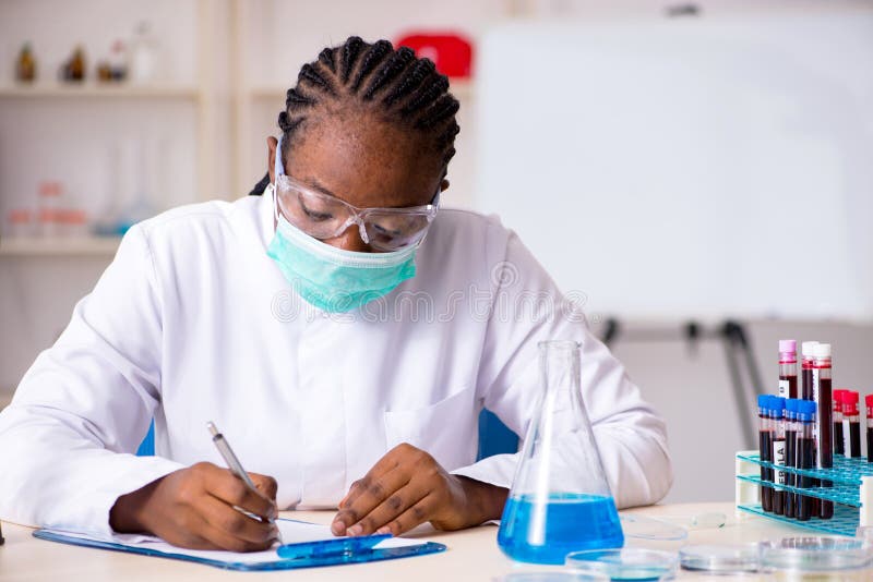 The Young Black Chemist Working in the Lab Stock Photo - Image of case ...