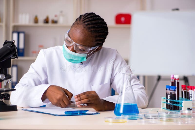 The Young Black Chemist Working in the Lab Stock Photo - Image of ...