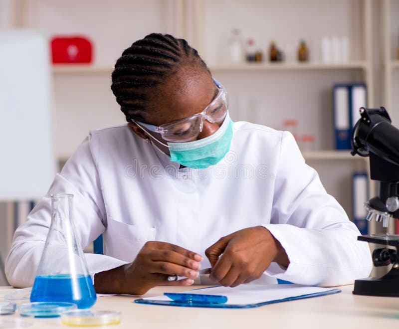 Young Black Chemist Working in the Lab Stock Image - Image of looking ...