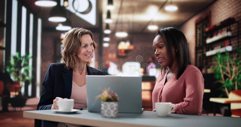 Young Black Designer and Analyst Collaborate Over Coffee Stock Photo ...