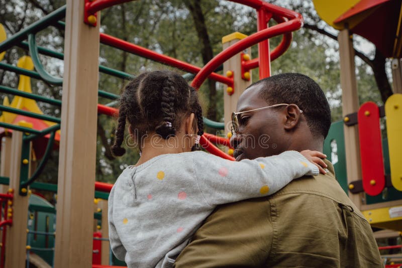 Young Black Father with His Daughter in a Playground Stock Image ...