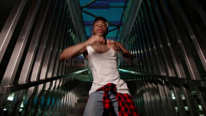 Young Black Guy Dancing on the Stairs. he Moves Rhythmically. Evening ...