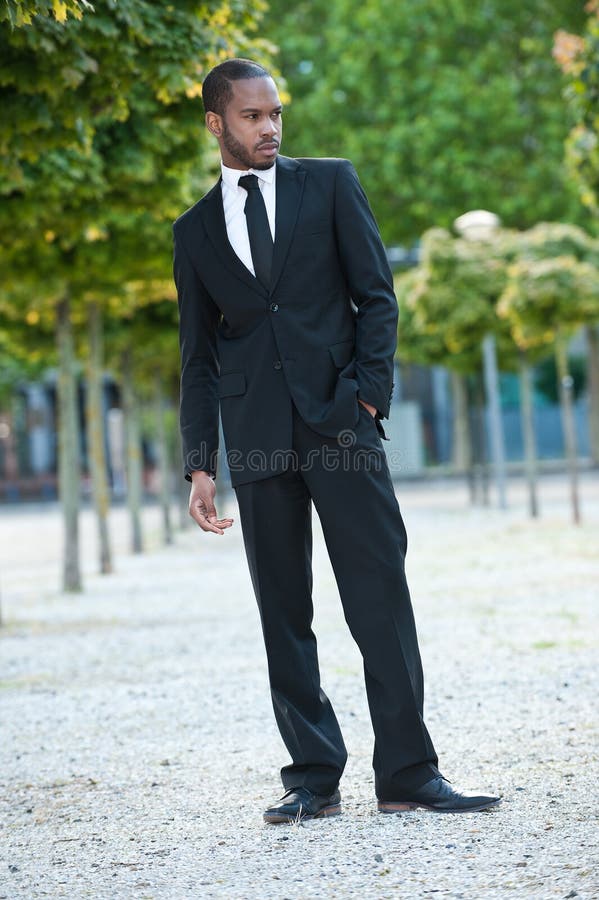 Young Black Male Staning in a Suit Outside Stock Image - Image of happy ...