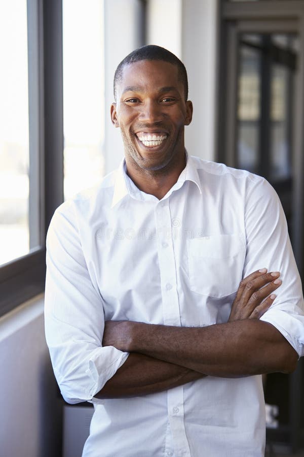 Young Black Man with Arms Crossed Smiling, Vertical Portrait Stock ...