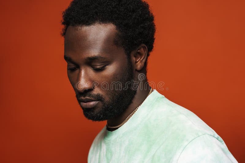 Young Black Man with Beard Posing and Looking Downward Stock Photo ...
