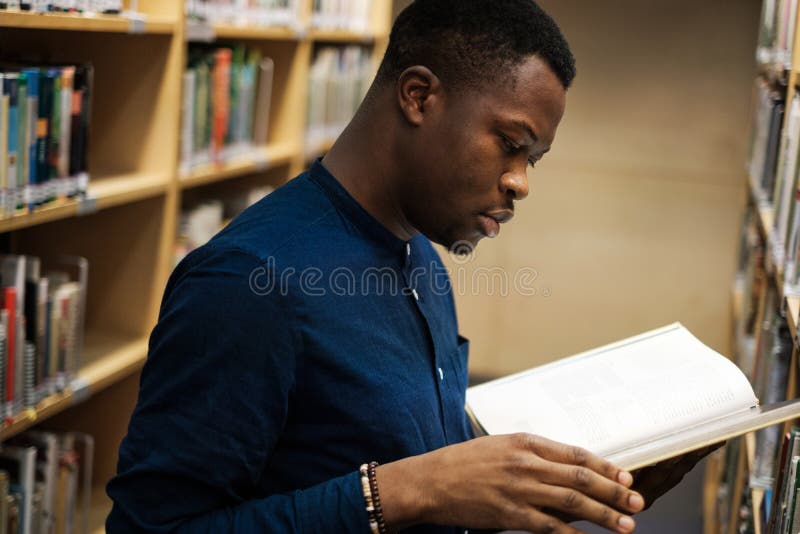 Black man reading a book stock image. Image of room, learning - 20730245