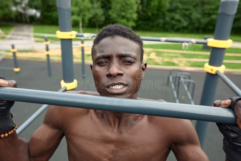 Young Black Man Doing Crunches Outdoors. he is in a Park. Stock Image ...