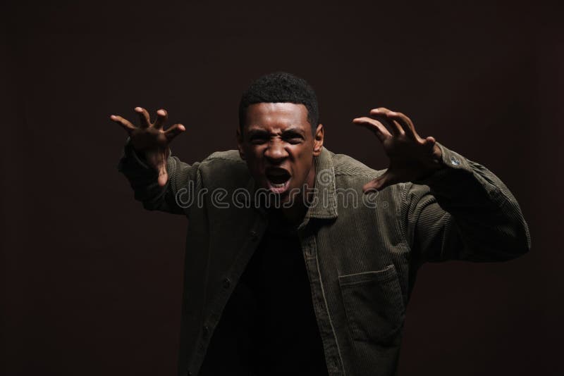 Young Black Man Gesturing and Screaming at Camera Stock Photo - Image ...