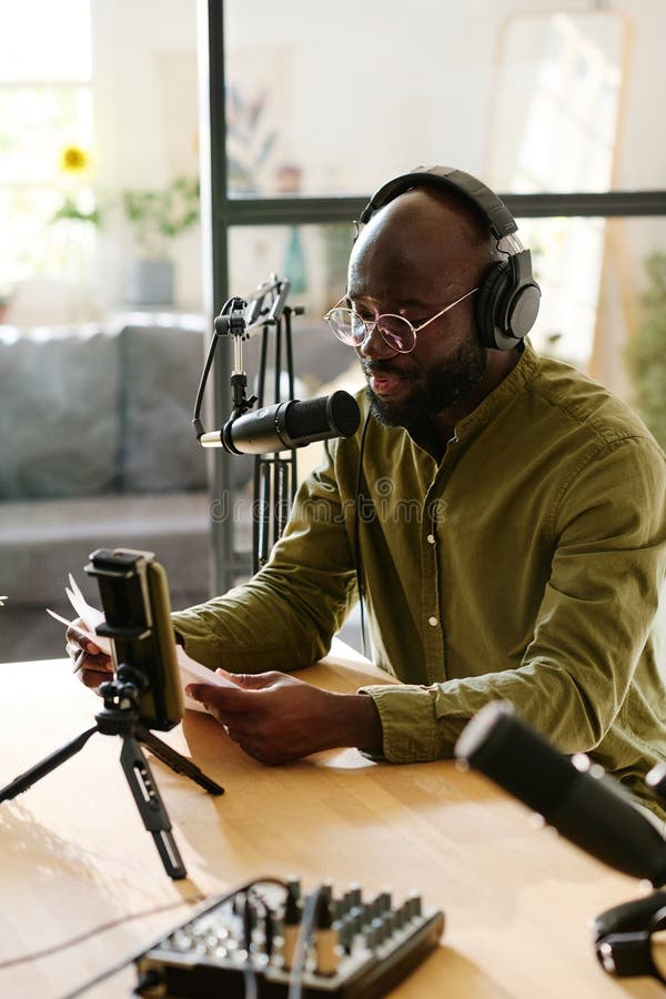 Young Black Man in Headphones Talking in Microphone while Reading His ...