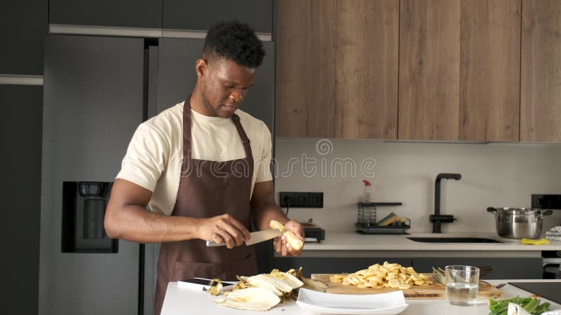 Young Black Man Hand Mixing Chicken Mince with Chopped Vegetables ...