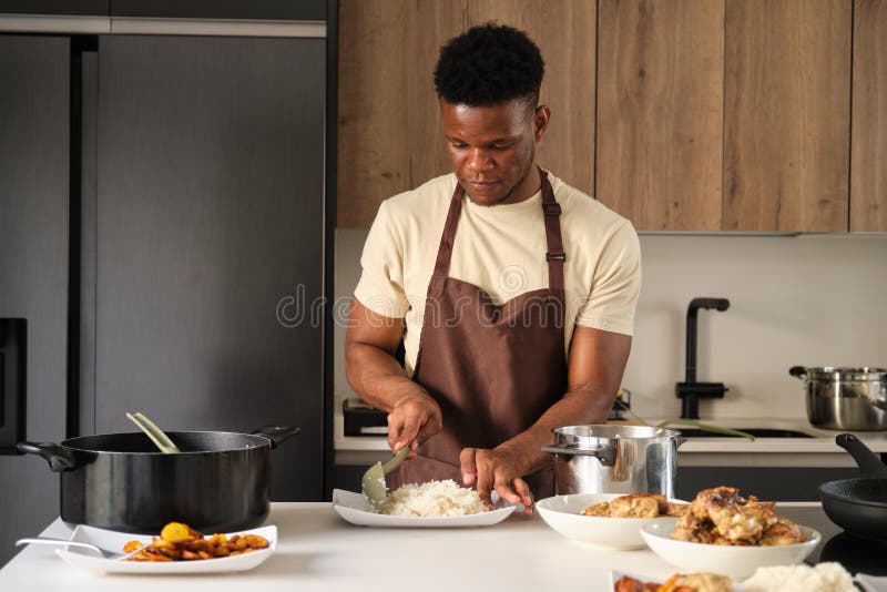 Young Black Man Serving Rice on a Plate. Stock Image - Image of home ...
