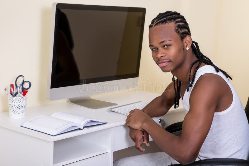 Young Black Man Sitting at Computer Stock Image - Image of camera ...