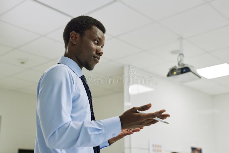 Young Black Man Teaching Class Stock Image - Image of candid, school ...