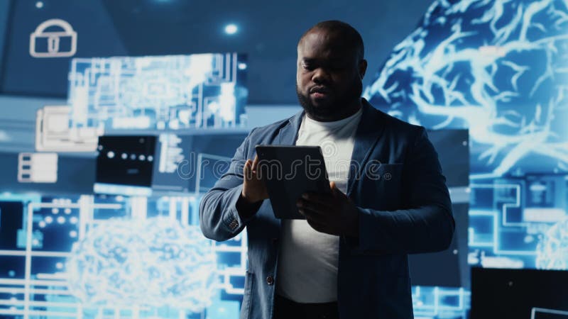 Young Black Technician Reviews Data Visualization and Neural Networks Platforms Stock Footage ...