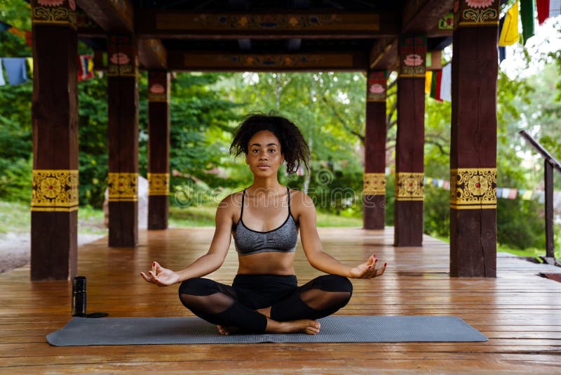 Young Black Woman Meditating during Yoga Practice Stock Photo - Image of gesture, class: 291851586