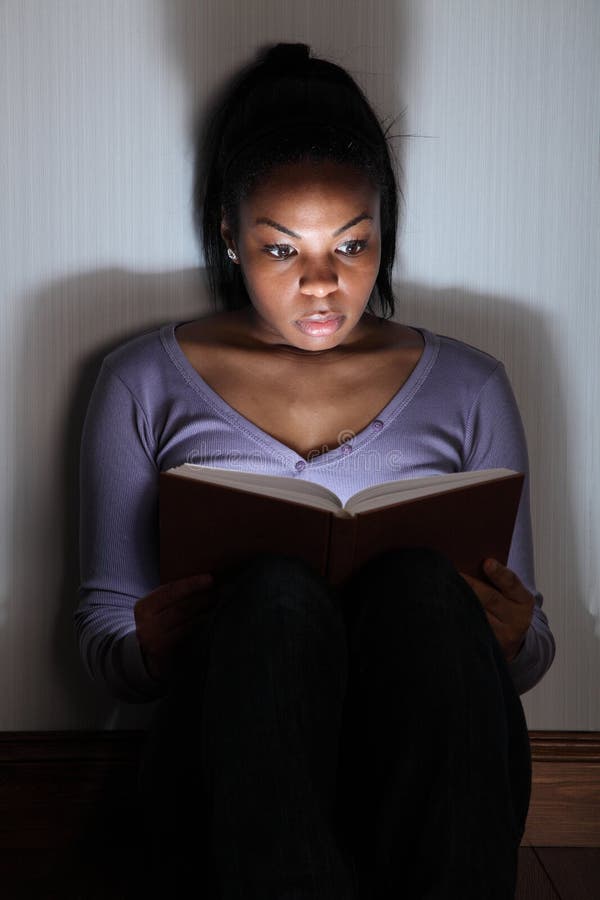 Young Black Woman Reading Scary Thriller Book Stock Image - Image of ...