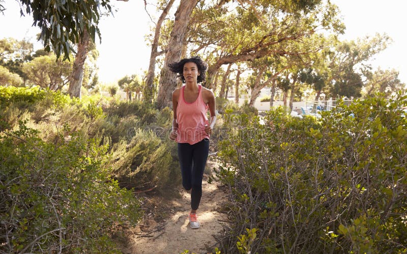 Young Black Woman Running through a Forest Stock Image - Image of great ...