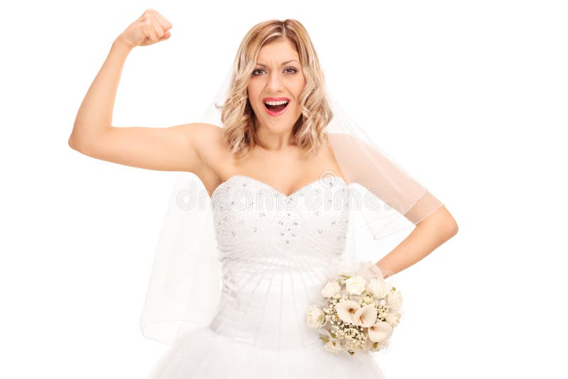 A Muscular Bride in a Wedding Dress Poses in Front of the Camera in the ...