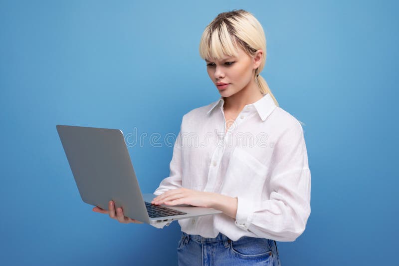 Young Blond Caucasian Woman With A Short Haircut Dressed In A White