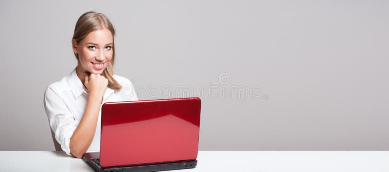 Young blond computer user. stock image. Image of shirt - 45295289