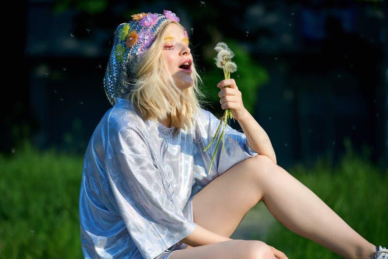 Young Blond Girl in Sparkling Hat with Dandelions Stock Photo - Image ...