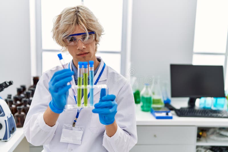 Young Blond Man Scientist Holding Test Tubes at Laboratory Stock Image ...