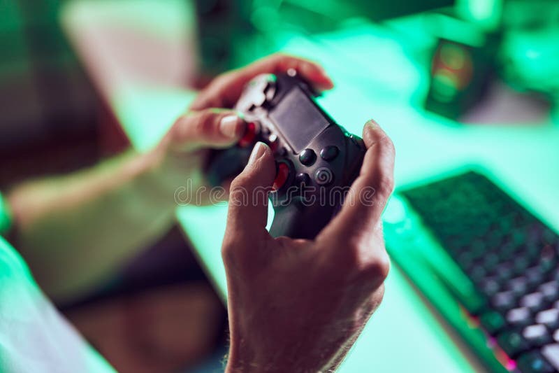 Young Blond Man Streamer Playing Video Game Using Joystick at Gaming ... Young Blond Man Streamer Playing Video Game Using Joystick at Gaming ...