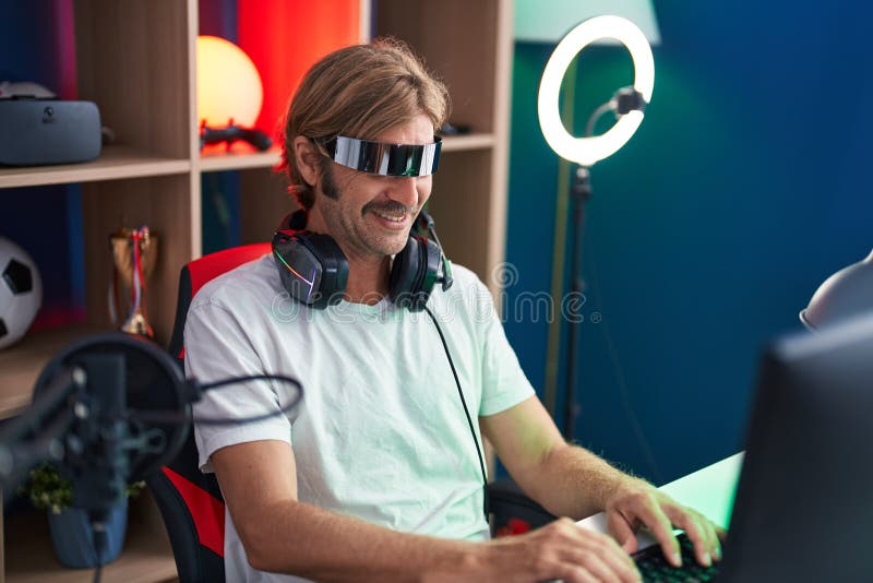 Young Blond Man Streamer Playing Video Game Using Virtual Reality ... Young Blond Man Streamer Playing Video Game Using Virtual Reality ...