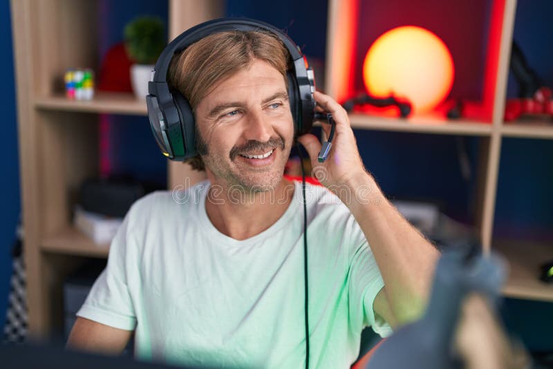 Young Blond Man Streamer Smiling Confident Sitting on Table at Gaming ...