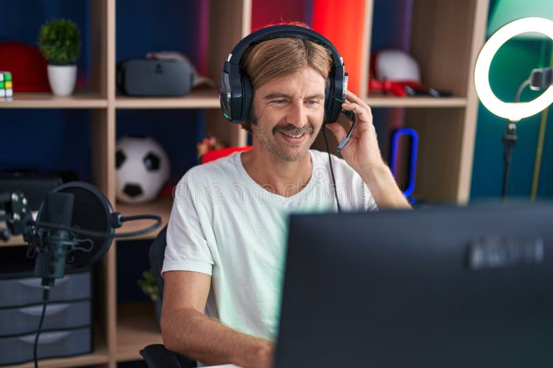 Young Blond Man Streamer Smiling Confident Sitting on Table at Gaming ...