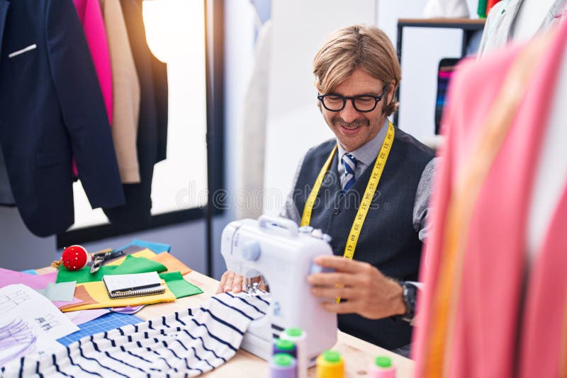 Young Blond Man Tailor Smiling Confident Using Sewing Machine at ...