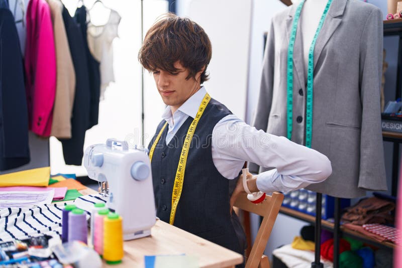 Young Blond Man Tailor Stressed Using Sewing Machine at Clothing ...