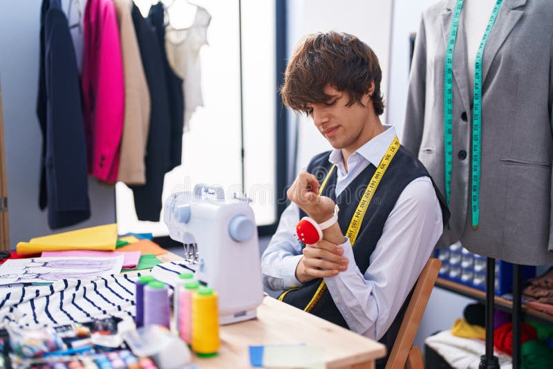 Young Blond Man Tailor Stressed Using Sewing Machine at Clothing ...