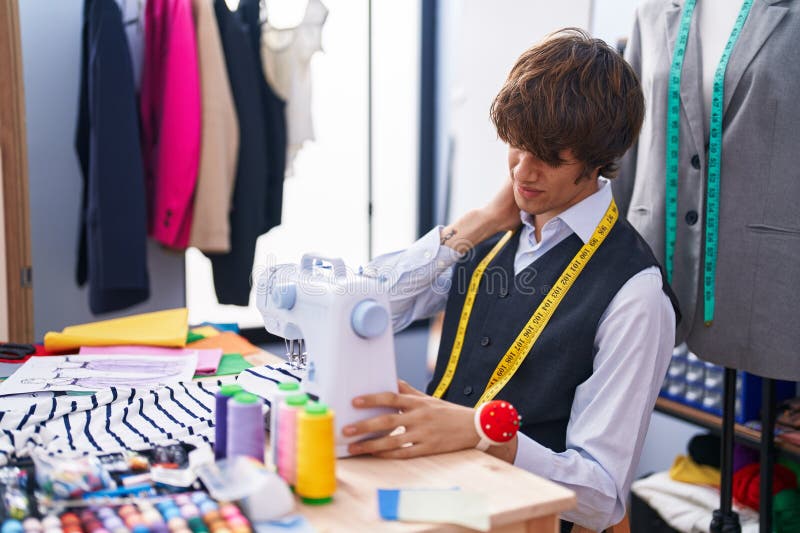 Young Blond Man Tailor Stressed Using Sewing Machine at Clothing ...