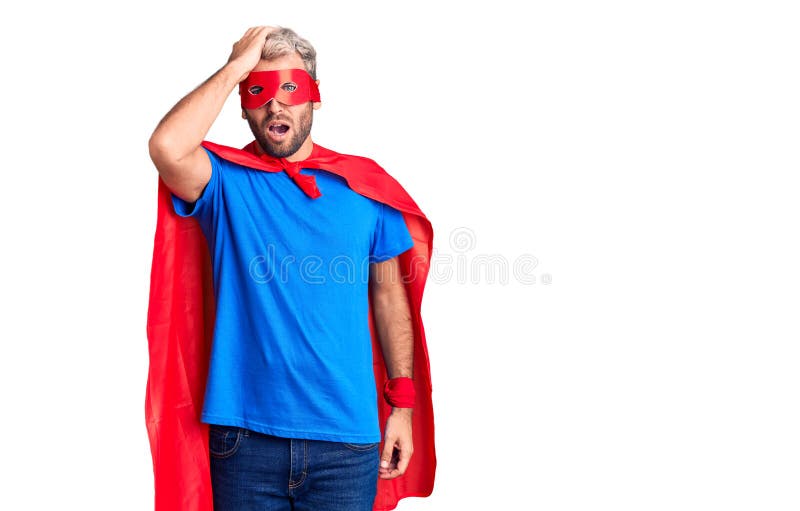 Young Blond Man Wearing Super Hero Custome Surprised with Hand on Head ...