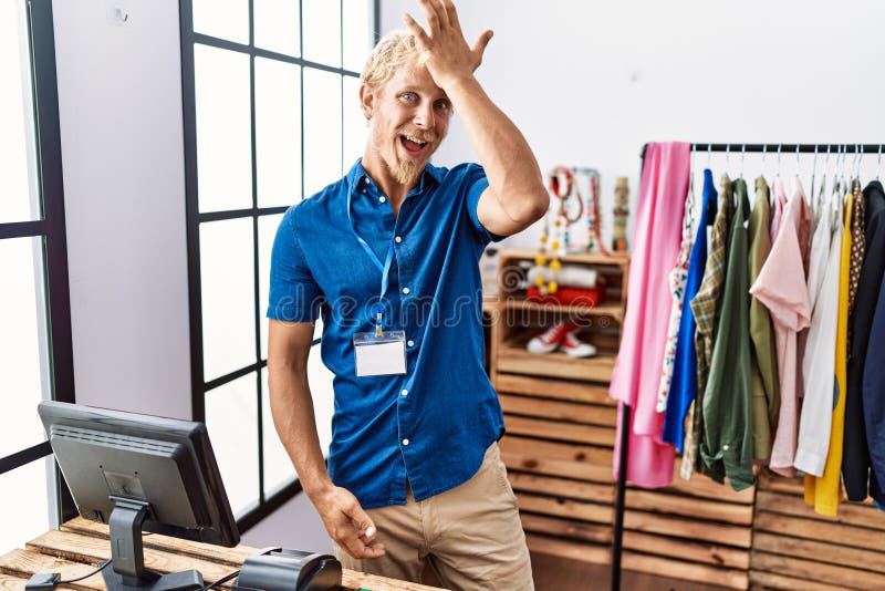 Young Blond Man Working As Manager at Retail Boutique Surprised with ...
