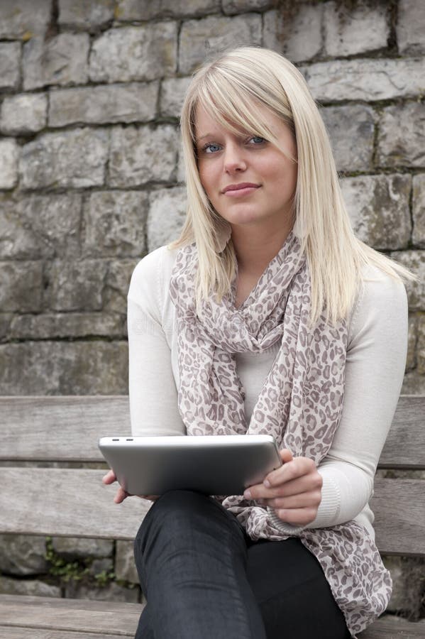 Young Blond Woman with Blue Eyes with Tablet Stock Photo - Image of ...