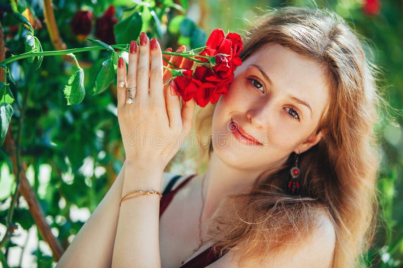 Young Blond Woman with Rose Portrait Stock Photo - Image of looking ...